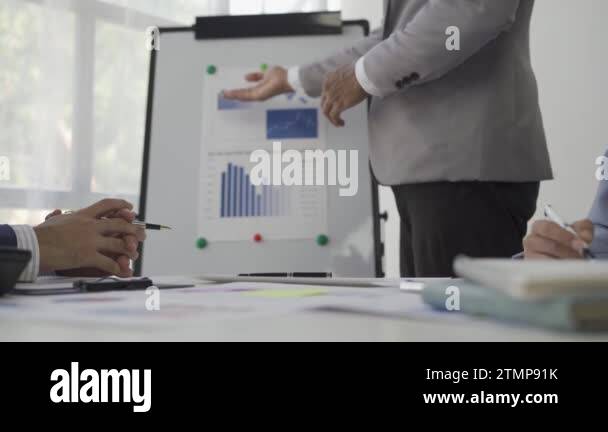 Accountant pointing to business graph chart Financial business report ...