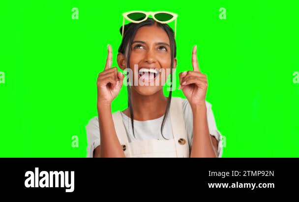 Green screen woman, excited face and pointing up at commercial promotion, advertising space or ...