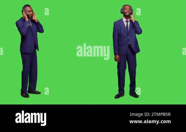 Male manager using headset listening to music on camera, having fun ...