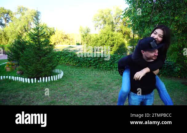 Girl Sits on Top of Guy and Embracing Neck, Male Rolls Lover Both ...