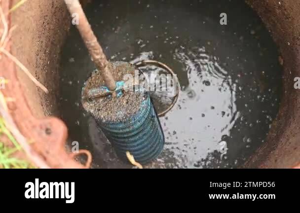 Man holding a Tuf - filter of septic system tank and water wells ...