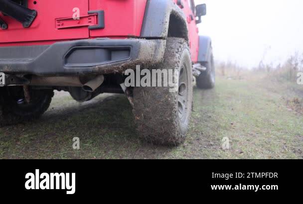 SUV with dirty wheels in nature in forest. Off-road driving in bad ...