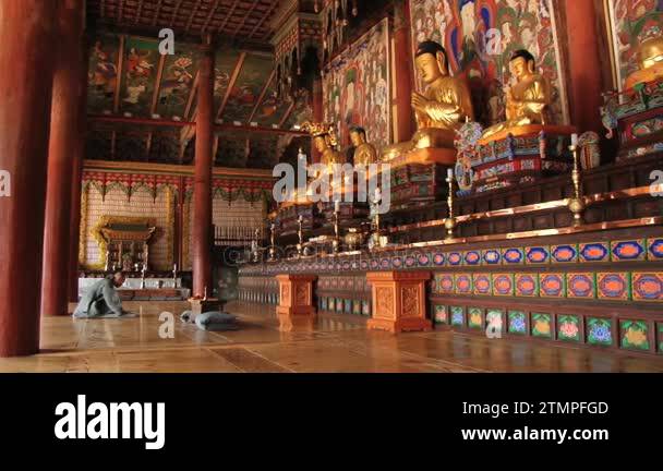 Monk prays in the Buddhist temple in Haeinsa monastery, Haeinsa, Korea ...