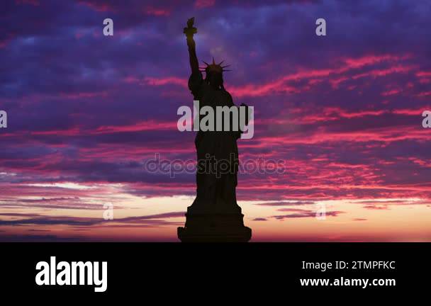 The Statue of Liberty, Sunrise Time Lapse. Sunbeam lights the torch of ...