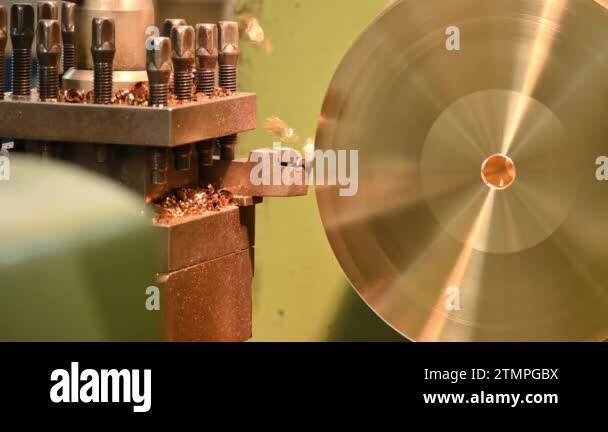 Closeup scene the lathe machine finish cut the brass parts by lathe ...