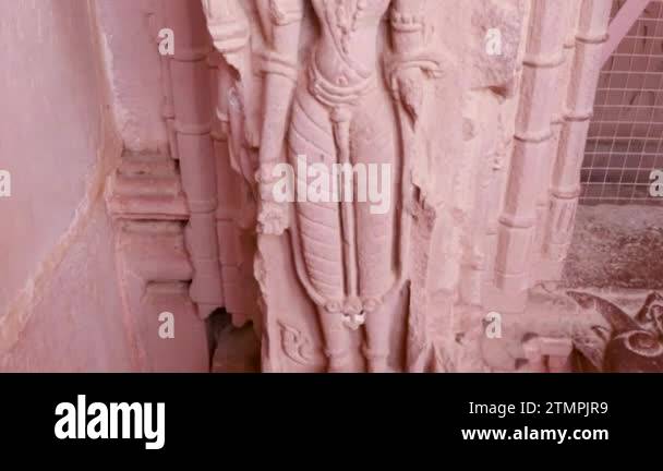 hindu god unique idol engraved art on temple wall from flat angle at ...