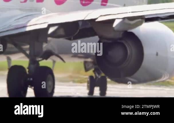 Close up at working engine jet of the airplane before taking off at hot ...
