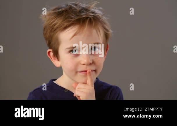 reflection body language-adorable little boy thinking about smart idea ...
