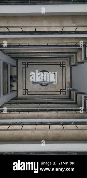 Unveil the awe-inspiring beauty of the atrium in a multistory building ...