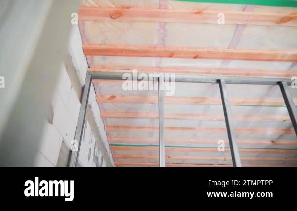 The room is without wall and ceiling cladding and without repair ...