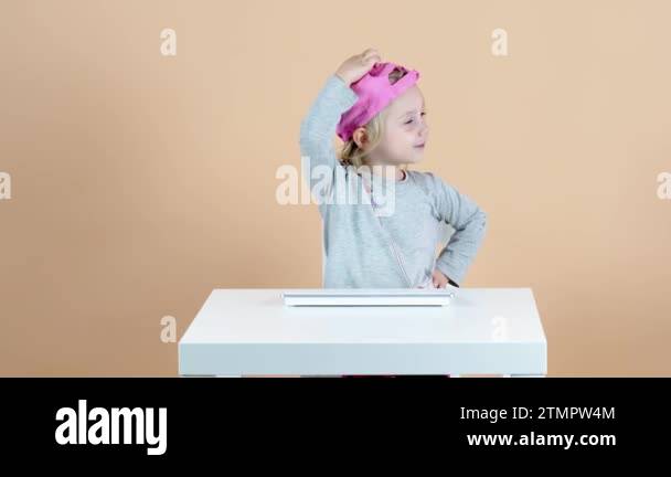 The child in front of the keyboard scratches his head and comes up with ...