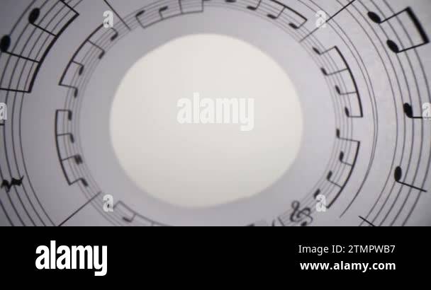 Rolled up sheet of paper with musical notes for playing symphony ...