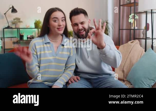 Ok. Happy cheerful family married couple man woman looking approvingly ...