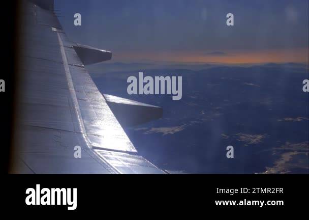 Aircraft wing and picturesque mountain landscape from high level from ...