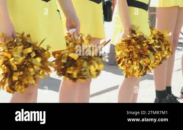 Cheerleaders girls dressed in yellow costumes Stock Video Footage - Alamy