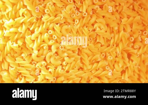 Uncooked Fusilli and Chifferi Rigati Pasta - Top View. Fat and ...