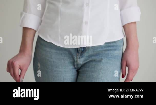 Woman covers groin with hand and shows SOS message. Girl suffers from ...