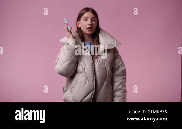 4k video of girl with cunning facial expression on pink background ...