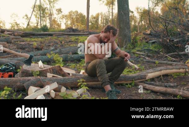 Shirtless tired sweaty man with muscular body smoking cigarettes having ...