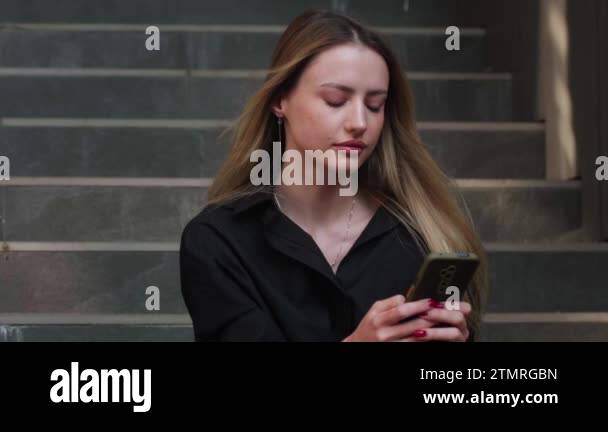 Stressed nervous young woman looking at cellphone screen, feeling ...