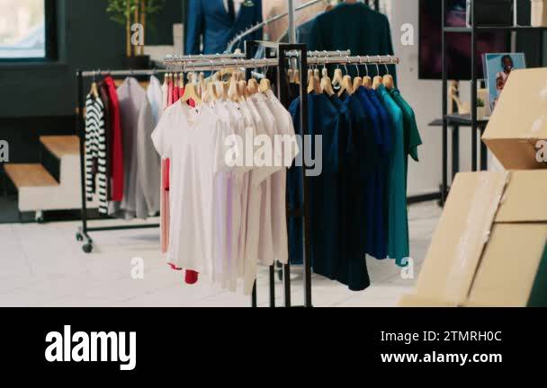 Empty shopping centre with casual and formal wear items, retail shop ...