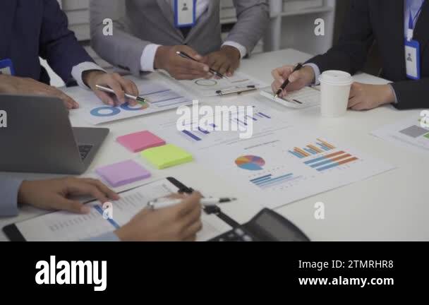 Accountant pointing to business graph chart Financial business report ...