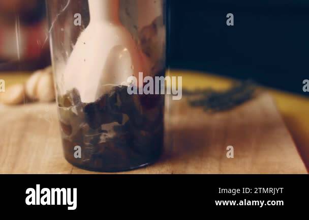 Close-up shot of unrecognizable male cook mincing champignons in ...