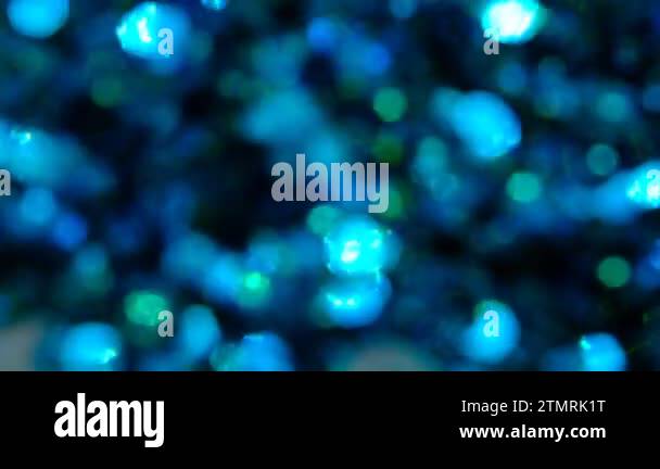 Golden glitter background. Beautiful transition with real gold particles. flying in wind on ...