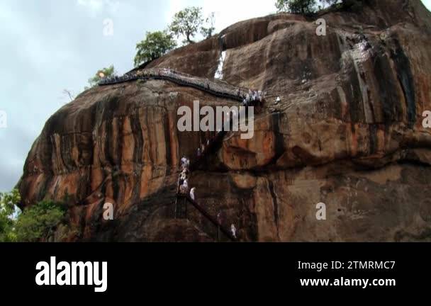 People climb and descend by the stairs visiting ruins of the ancient ...