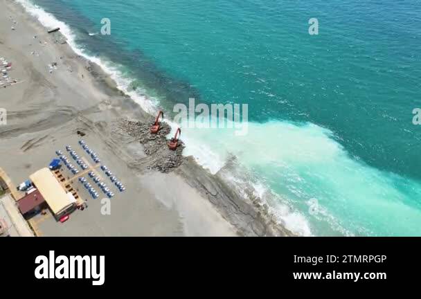 Capture the waves of progress through an aerial view of a beach ...