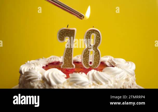A candle in the form of the number 78, inserted into the holiday cake ...