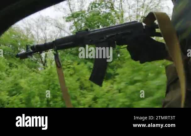 Armed man goes outside the car. Inside view, in the frame can be seen ...