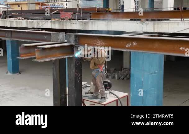 Observe the remarkable rooftop transformation as workers meticulously ...