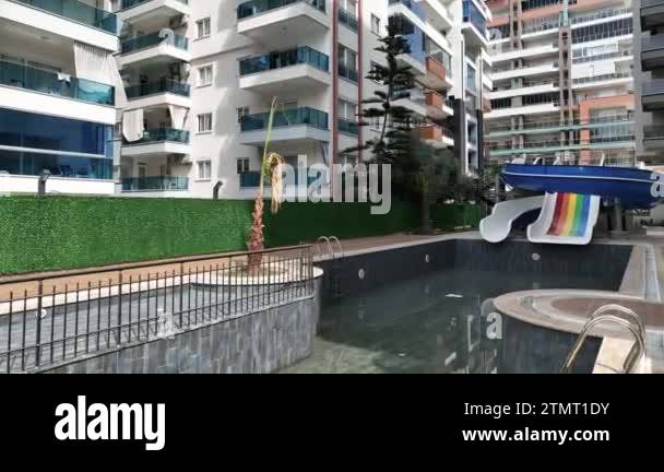 Witness a splash of colors from above as the drone captures the lively rainbow waterslide in the ...