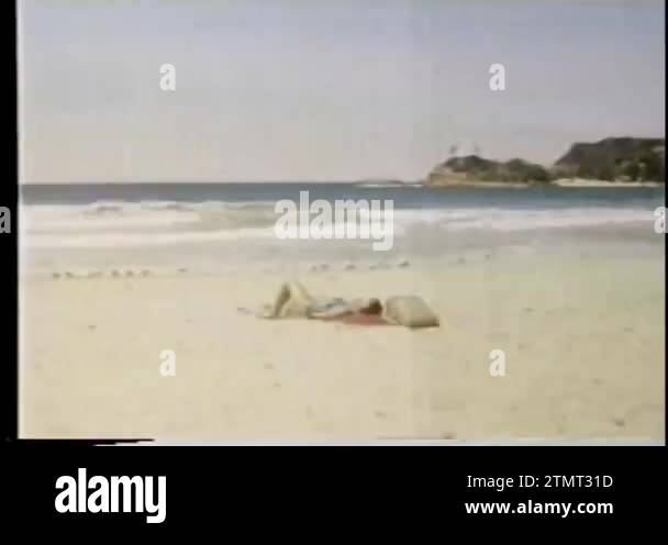 Tanning on beach Stock Videos & Footage - HD and 4K Video Clips - Alamy