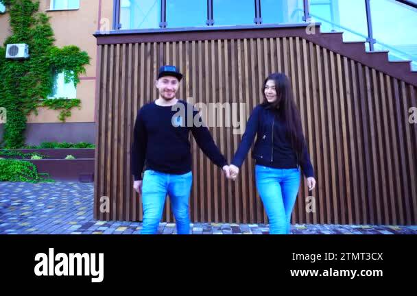 Sweetheart Female and Male go Directly at Camera and Hold Hands ...