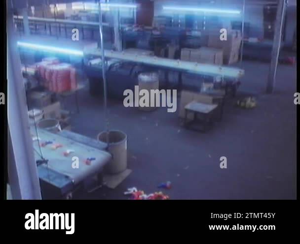 Toys falling off factory conveyor belt Stock Video Footage - Alamy