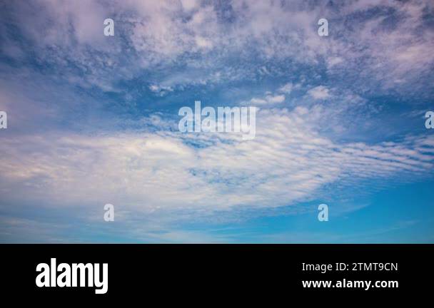 Time Lapse beautiful white clouds moving in blue sky.The clouds were ...
