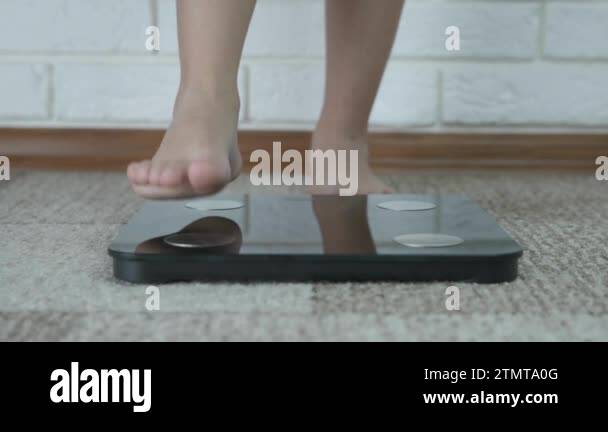 Female feet on a scale Stock Videos & Footage - HD and 4K Video Clips ...