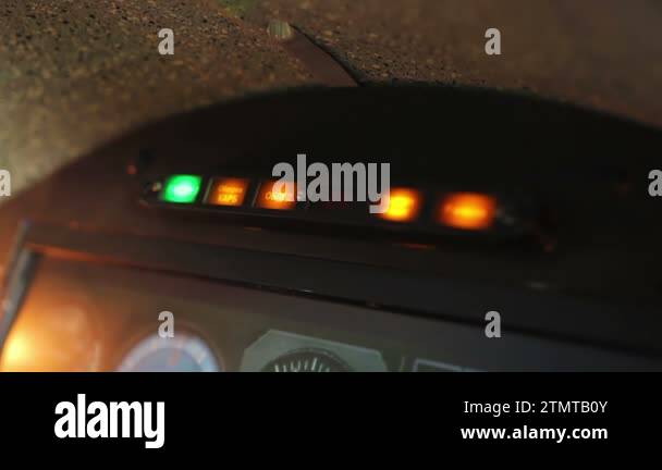Fire alarm indicator blinking red on cockpit panel, emergency warning ...