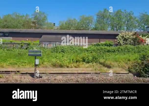 Outside View from Window Seat of Train Moving Fast to Approach Next ...