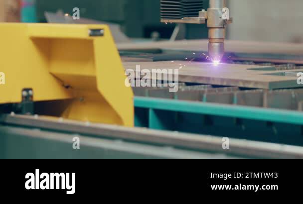 Plasma laser cutting metal sheets with sparks, precision fabrication ...