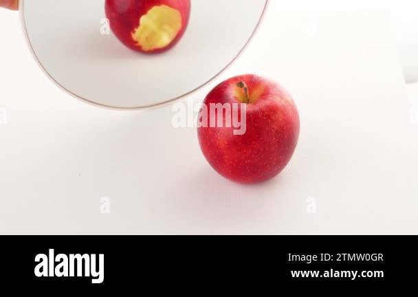 Concept photo. Ripe red apple isolated on white. An apple and its ...
