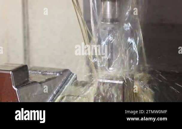 Close up scene the CNC milling machine cutting the injection mold parts ...