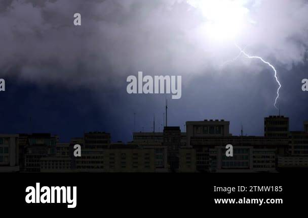 Heavy thunderstorm clouds above city rooftops, severe lightning storm ...