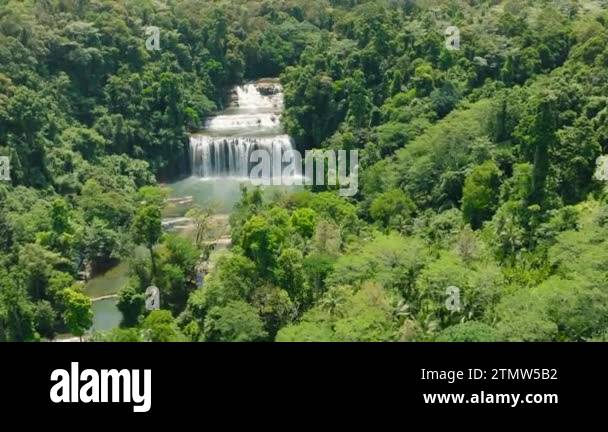 Stunning aerial drone view of multi tiered waterfall. Tinuy an falls ...