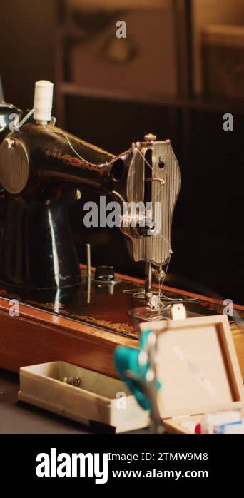 Vertical video Fashion atelier sewing machine and tools on workshop ...