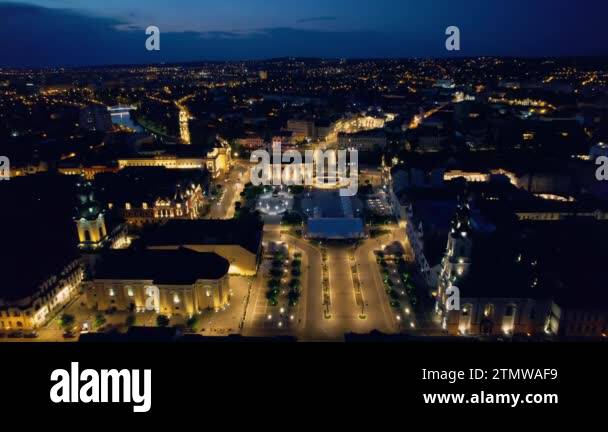 Areal drone view of the Unirii Square in Oradea downtown at night ...