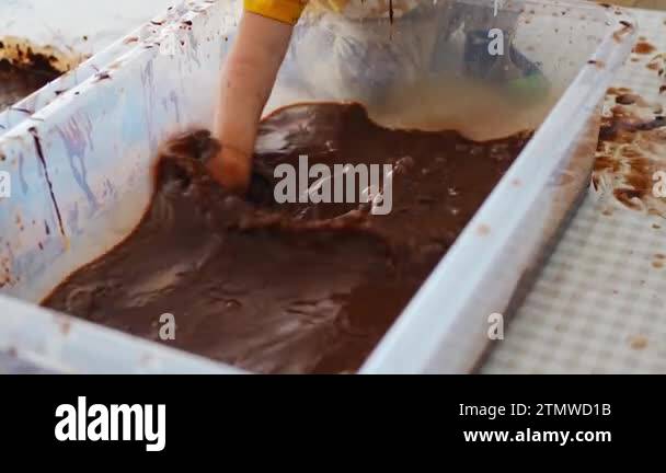 Homemade chocolate sensory mud with farm animal models. Sensory ...