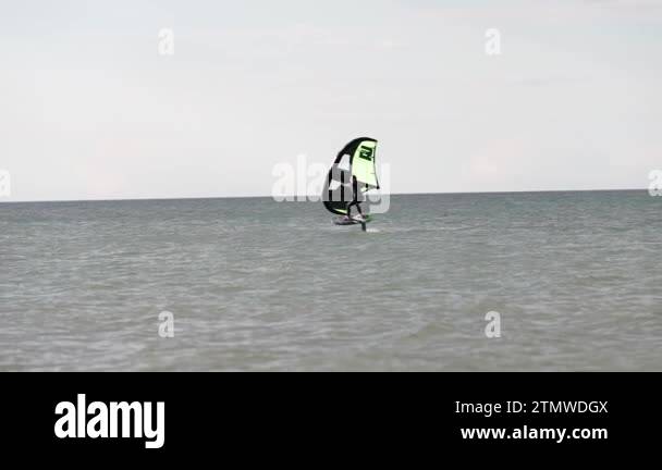 Modern water sport. Hydrofoil ride on the ocean using the wing and the ...